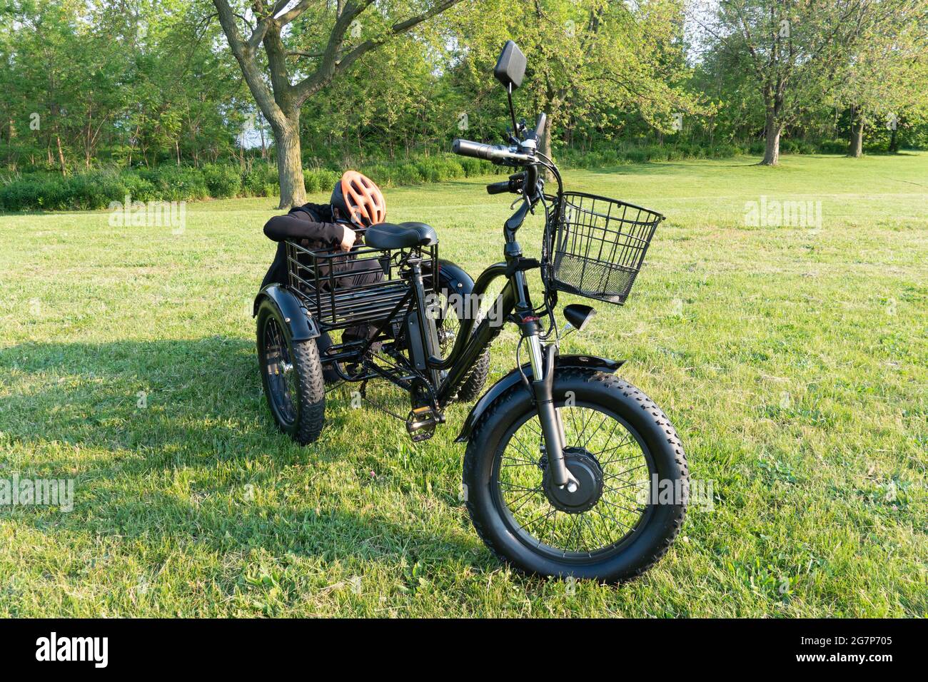 Woman in the hamlet hold the key of the electric bicycle battery pack ...