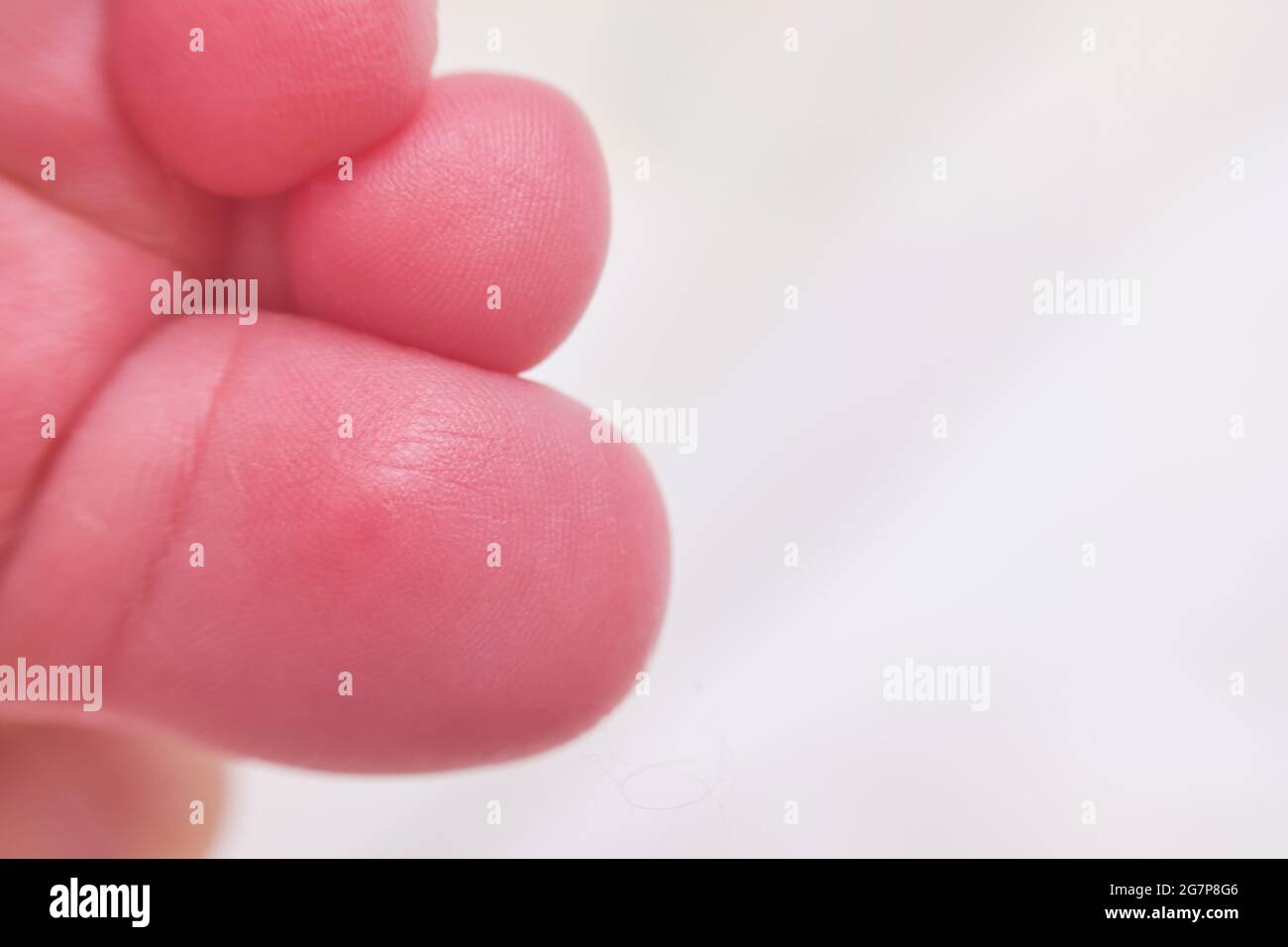 Toes on the foot of a newborn baby, close-up. Macro photo of a healthy ...