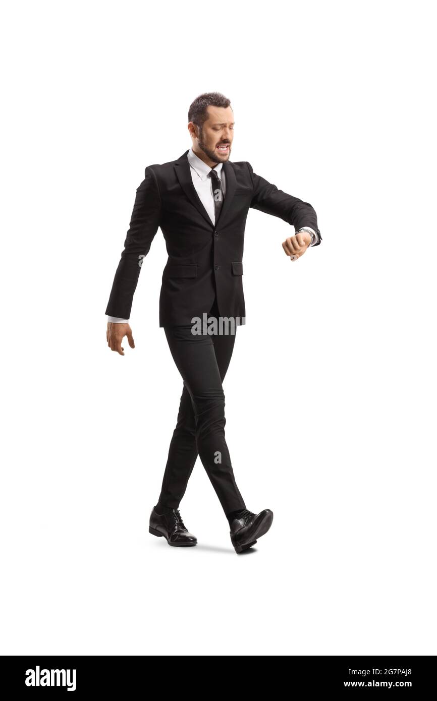 Businessman walking fast and checking time isolated on white background ...