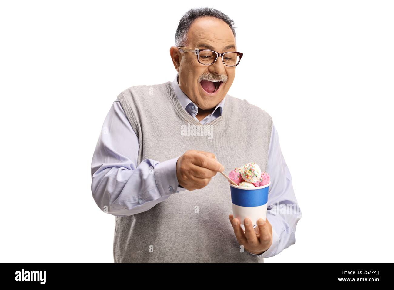 Happy mature man eating ice cream in a paper cup isolated on white ...