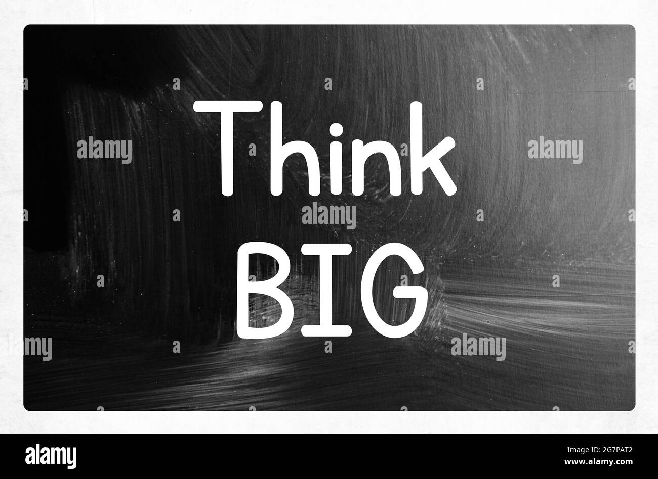 Grayscale illustration with the phrase "Think big" on the blackboard ...