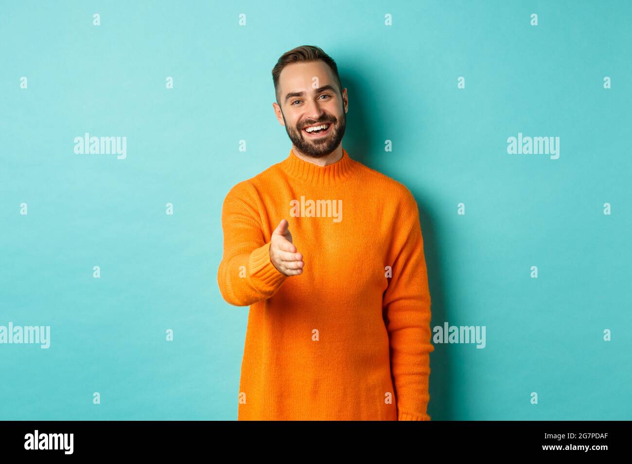 Friendly nice guy extend hand for handshake, greeting you and smiling ...