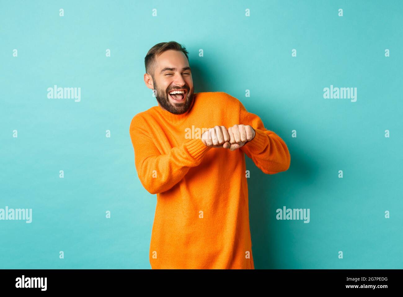 Happy man dancing and celebrating success, feeling like winner, smiling ...