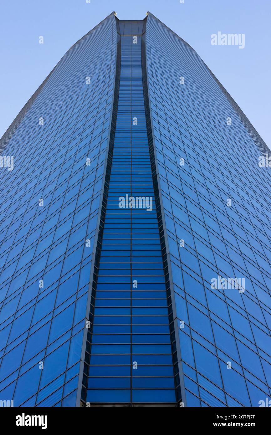 Close up on tall glass skyscraper view from below. Financial blue ...