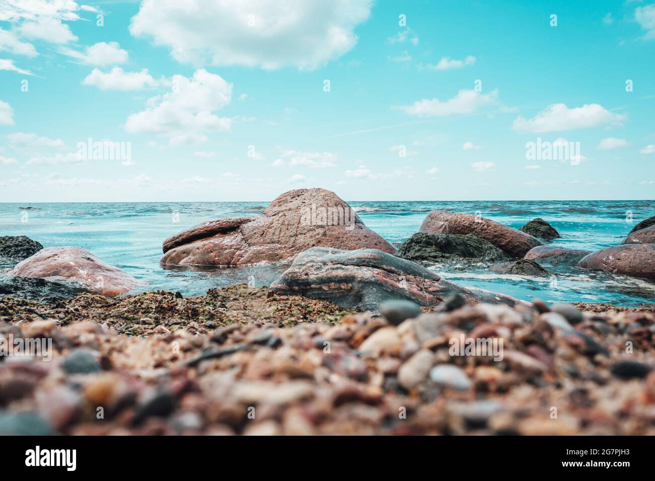 Beautiful scenery of rocks and pebbles on the beach Stock Photo - Alamy