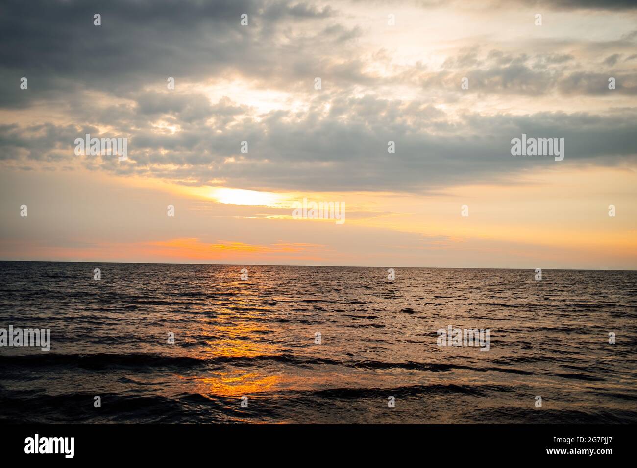 Beautiful scenery of a sea at sunset Stock Photo - Alamy