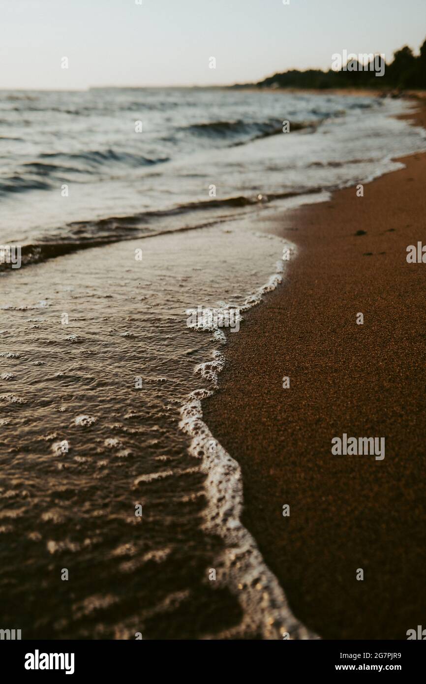 Beautiful scenery of the beach with splashing sea waves Stock Photo - Alamy