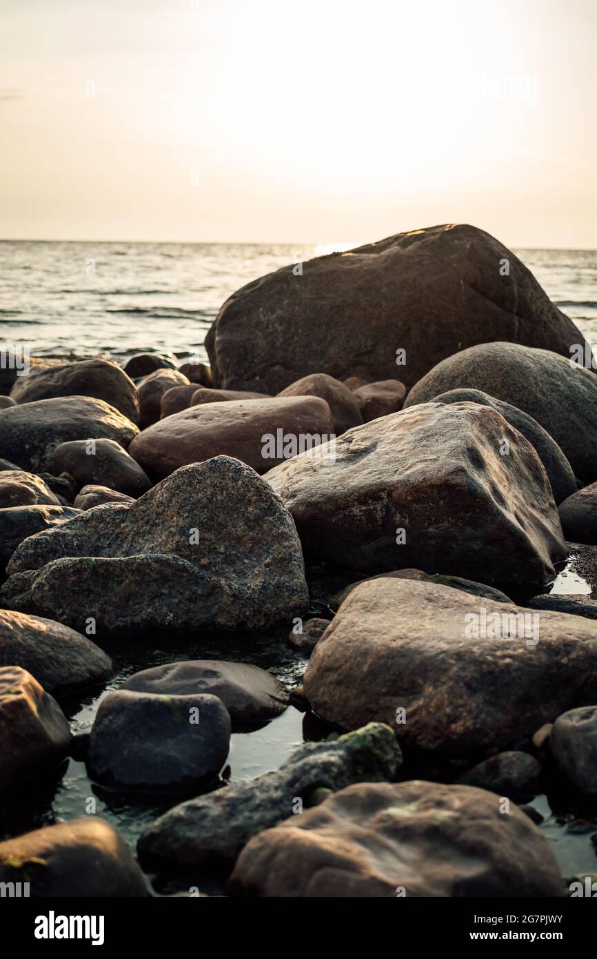 Beautiful scenery of rocks and pebbles on the beach Stock Photo - Alamy