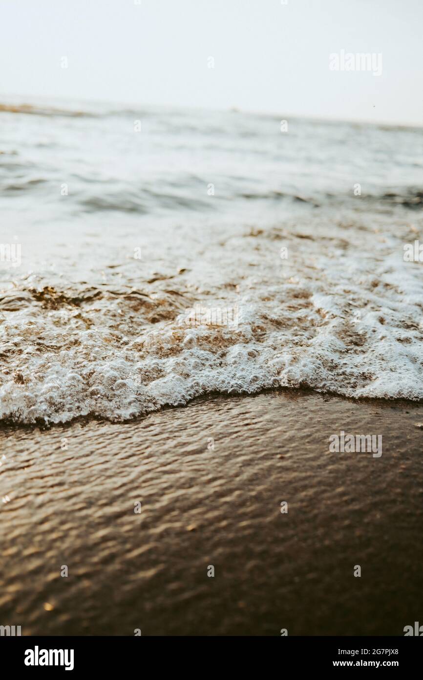 Beautiful scenery of the beach with splashing sea waves Stock Photo - Alamy