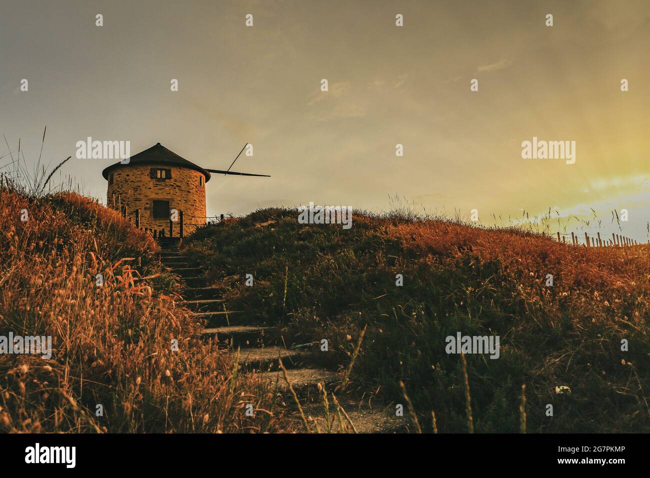 Medieval stone building view from a path going towards it at the ...