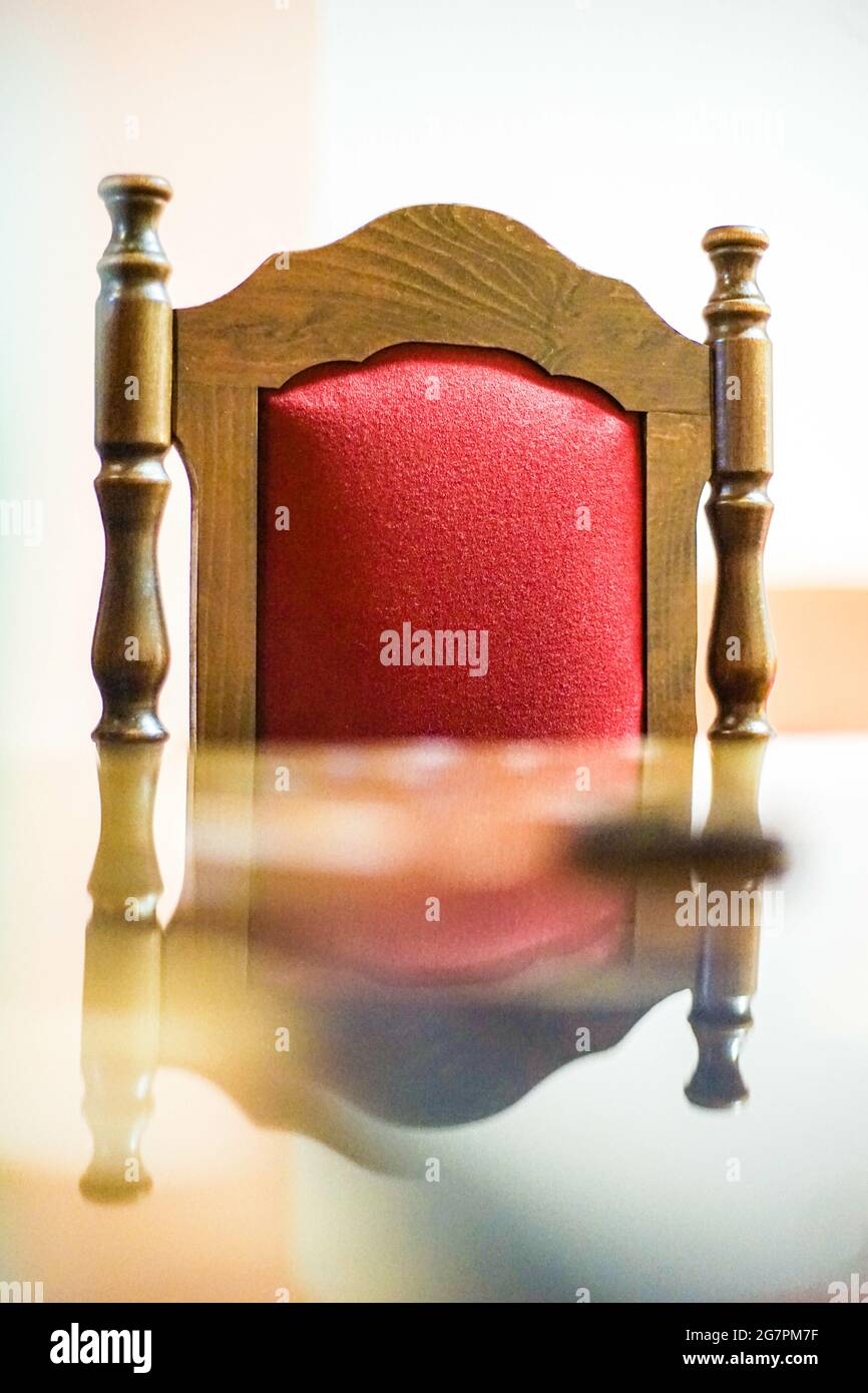 Closeup shot of an empty wooden chair in a white room Stock Photo - Alamy