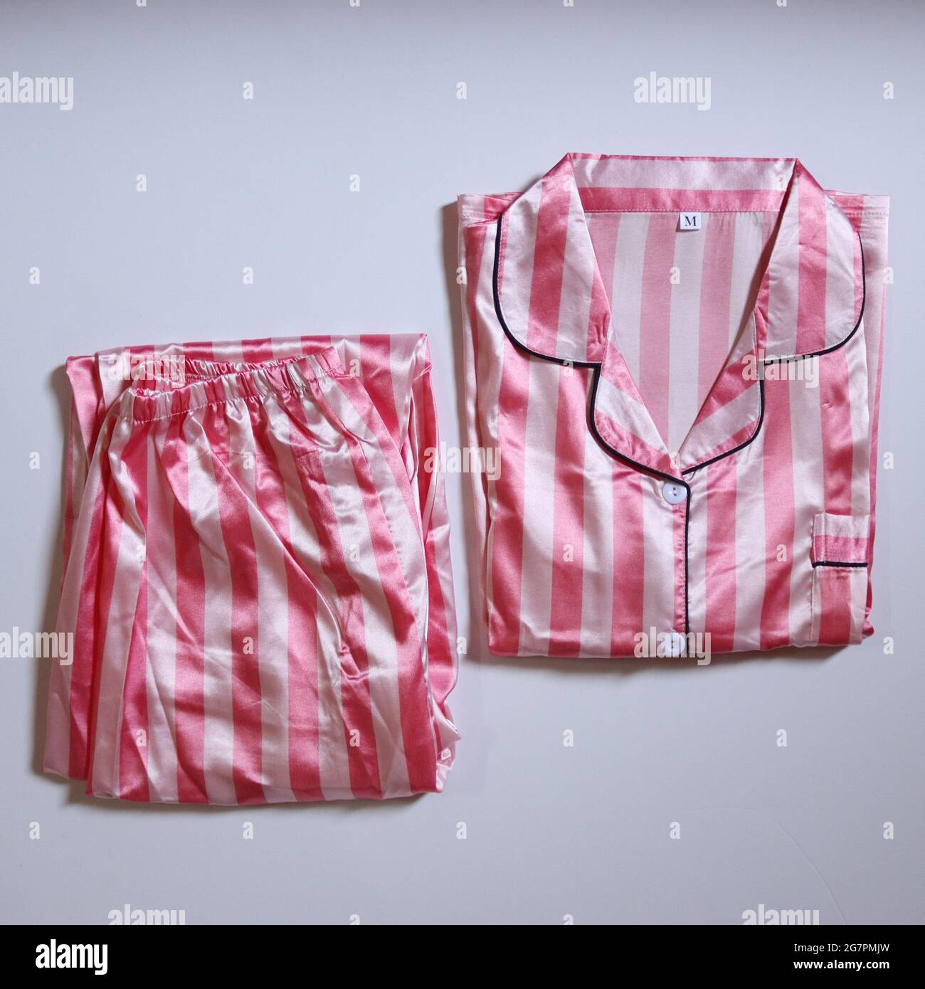 Pink satin pajamas set Stock Photo - Alamy