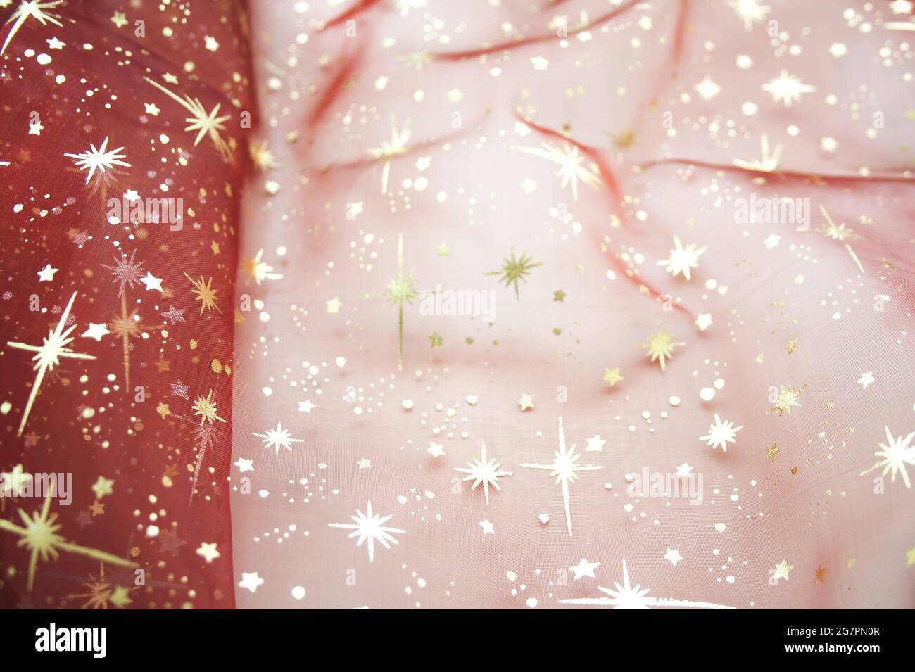 Red organza background with stars on it Stock Photo - Alamy