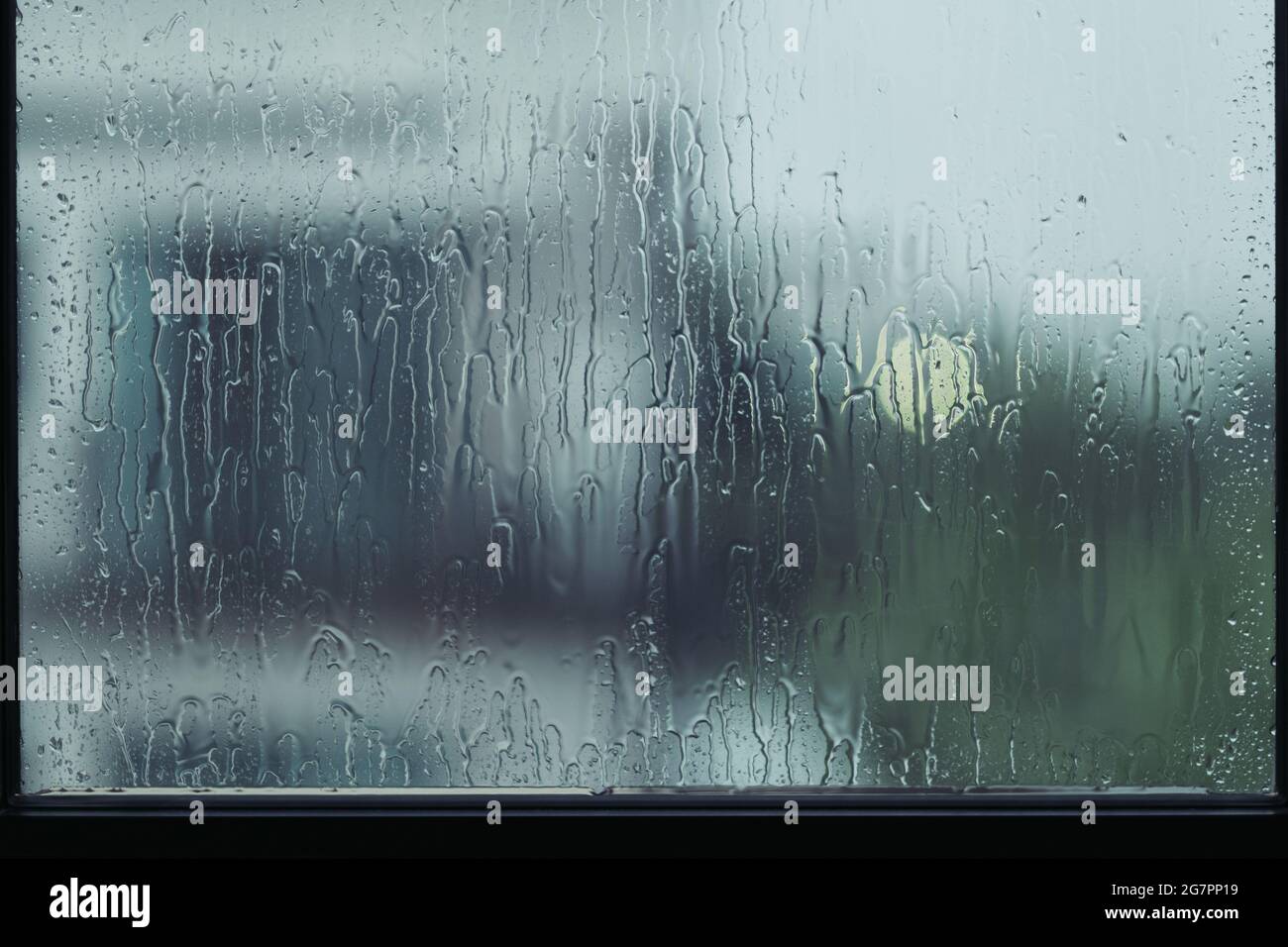 rain drops during raining in rainy day outside window glass with ...