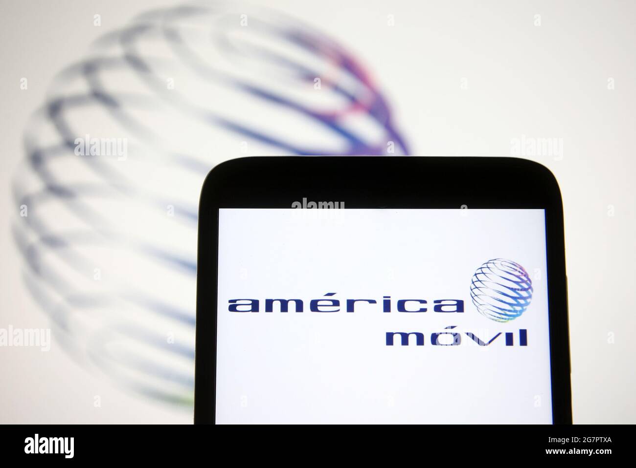 In this photo illustration an America Movil logo of a ...