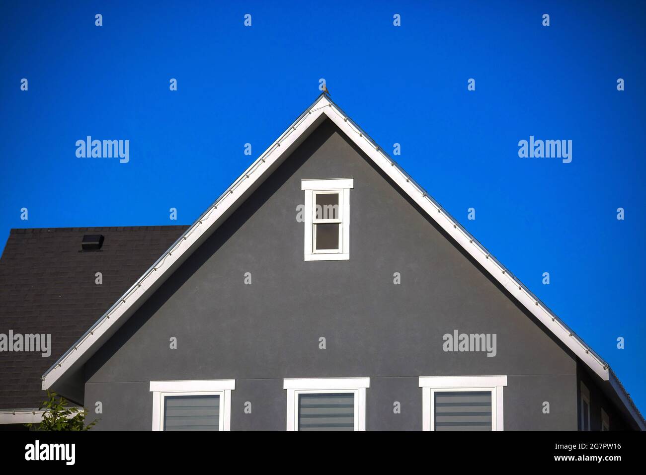 Gray rooftop with attic windows under the sky Stock Photo - Alamy