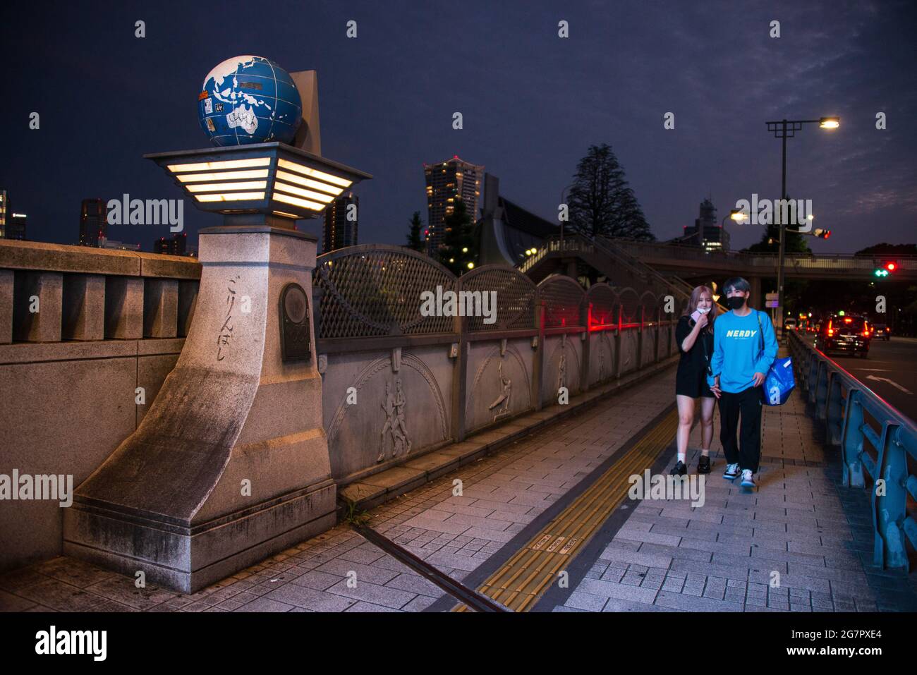 Pedestrians pass over the Olympic Bridge near Yoyogi Park, Tokyo on 21 ...