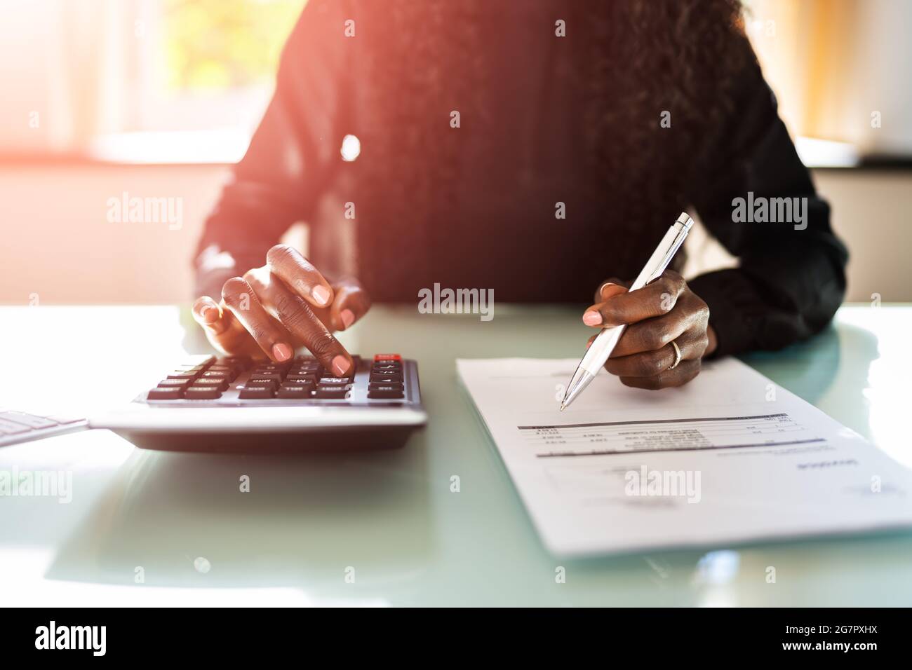 Public African Tax Accountant Using Calculator. Finance Ledger Stock ...