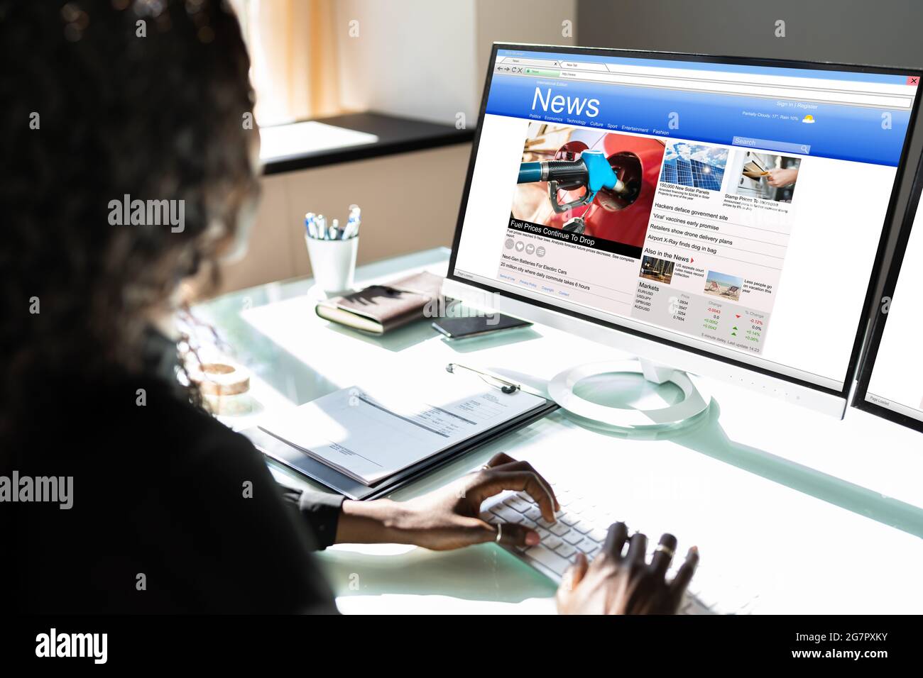 African american girl reading newspaper hi-res stock photography and ...