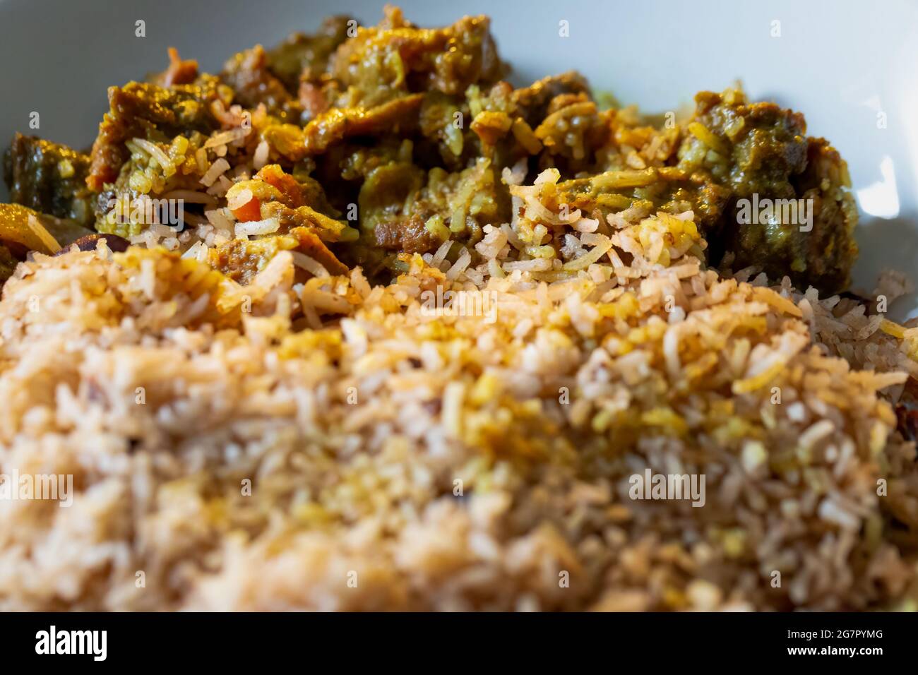 Jamaican goat curry rice hi-res stock photography and images - Alamy