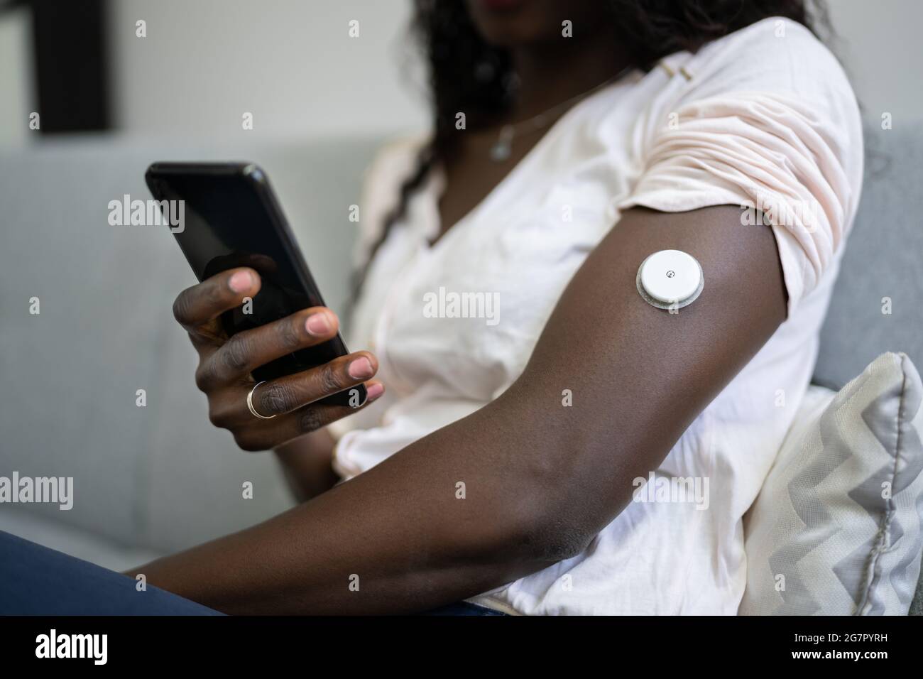 African Woman Using Continuous Glucose Remote Monitor Diabetes Sensor ...