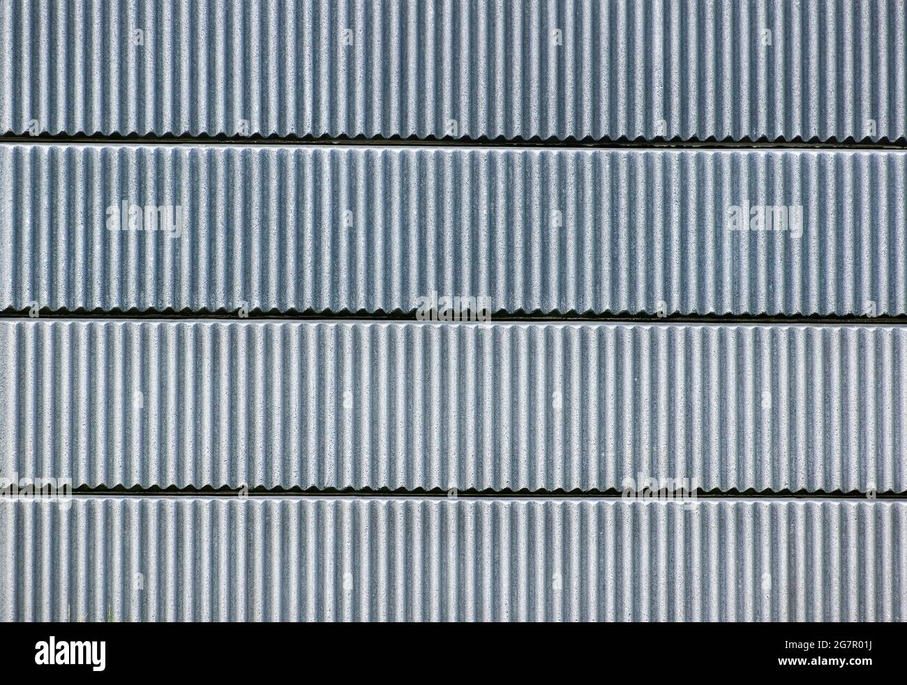 Four white blocks with vertical grooves Stock Photo - Alamy