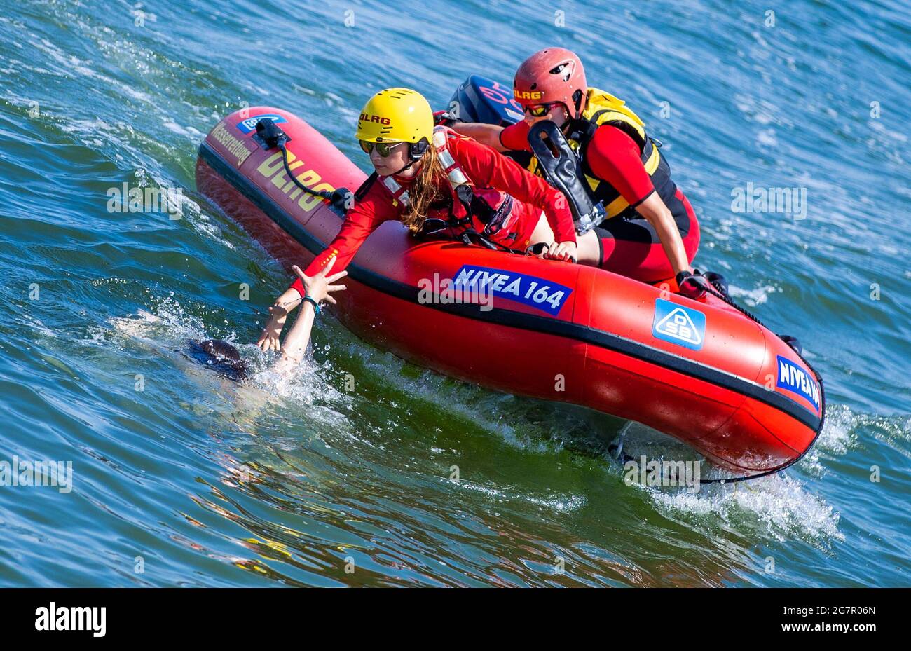 Prerow, Germany. 15th July, 2021. Lifeguards Pauline Geipel (front) and ...