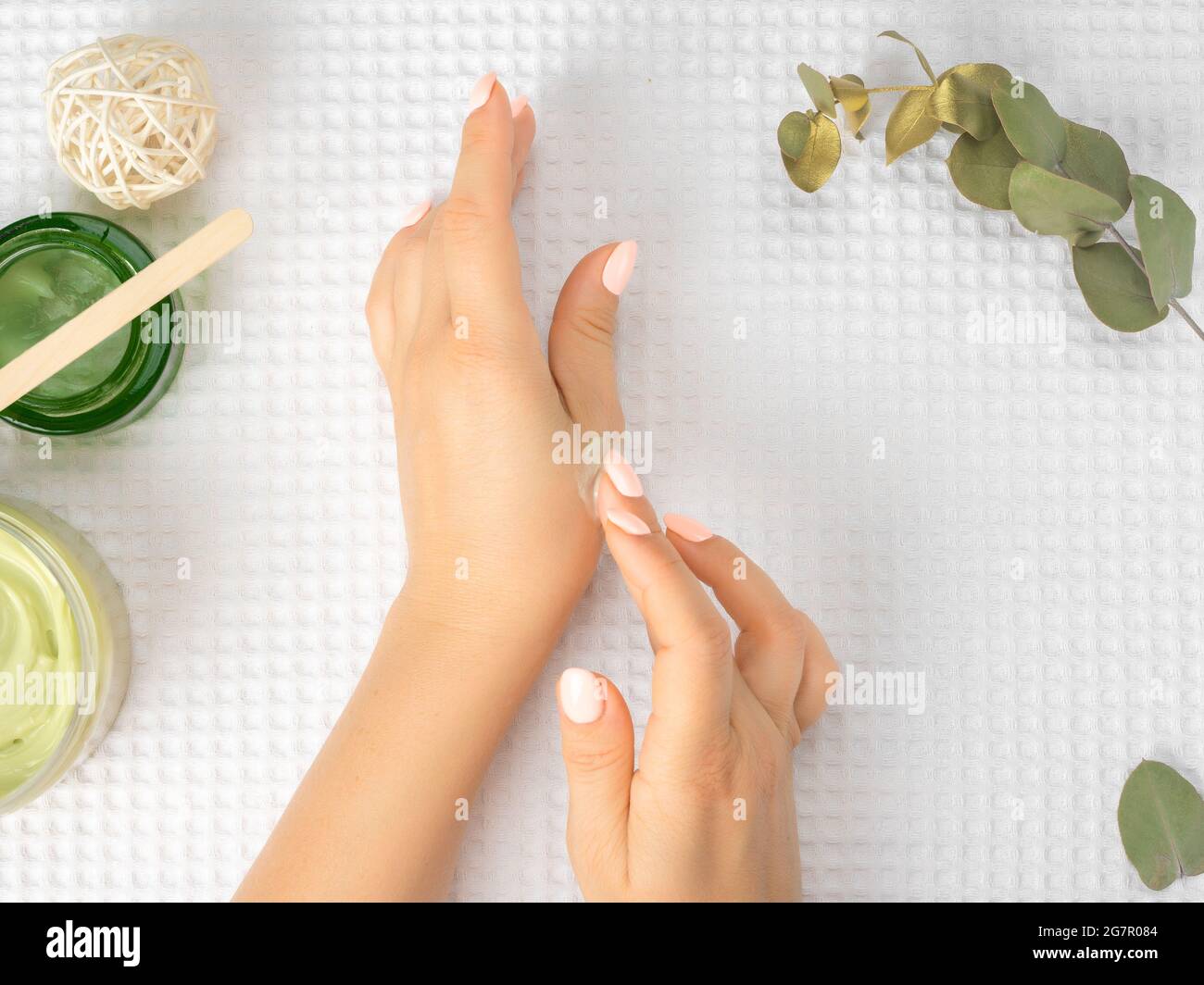 woman hands applying moisturizing cream to her skin. Beautiful woman's ...