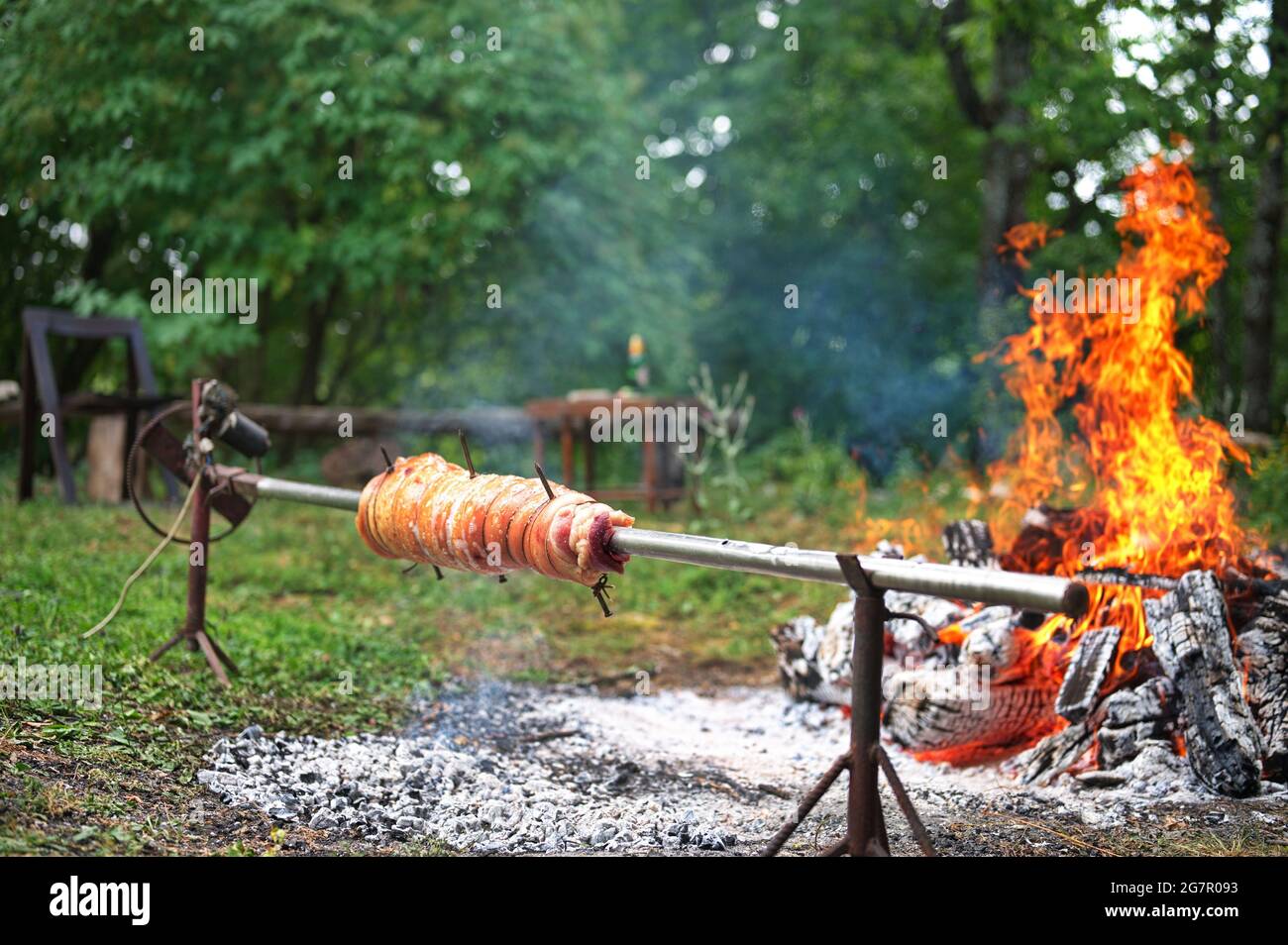 Pork meat baked on a spit Stock Photo - Alamy