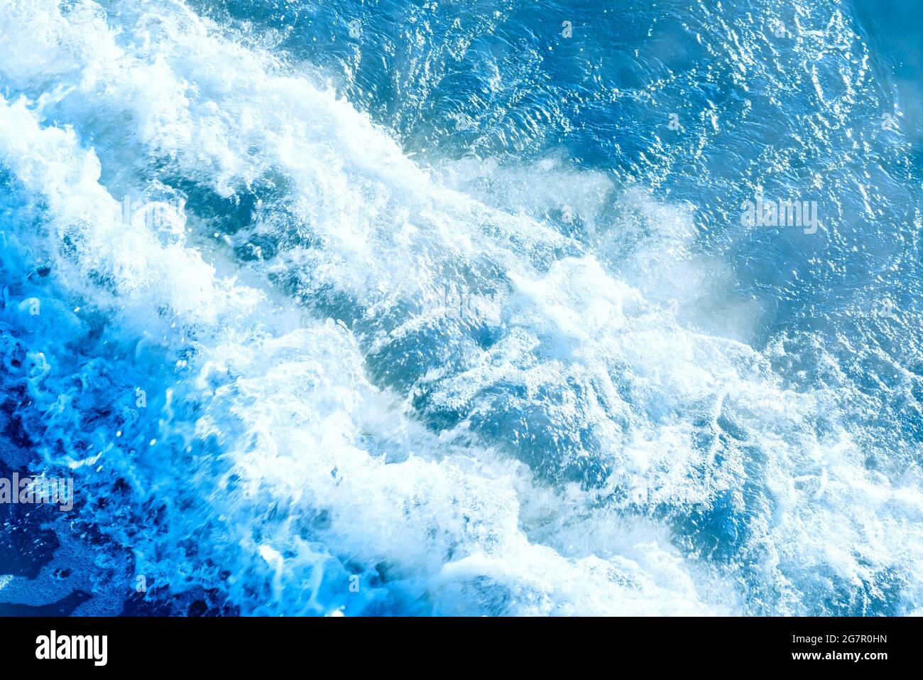Areal shot of deep blue and rough sea with lot of sea spray.Blue ...