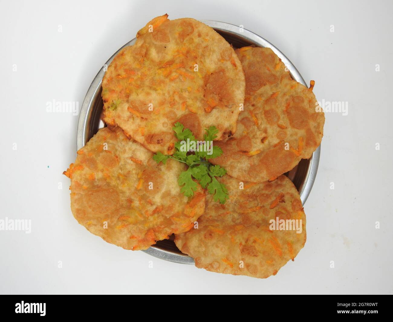 Carrot puri with vegetable curry on big plate isolated on white ...