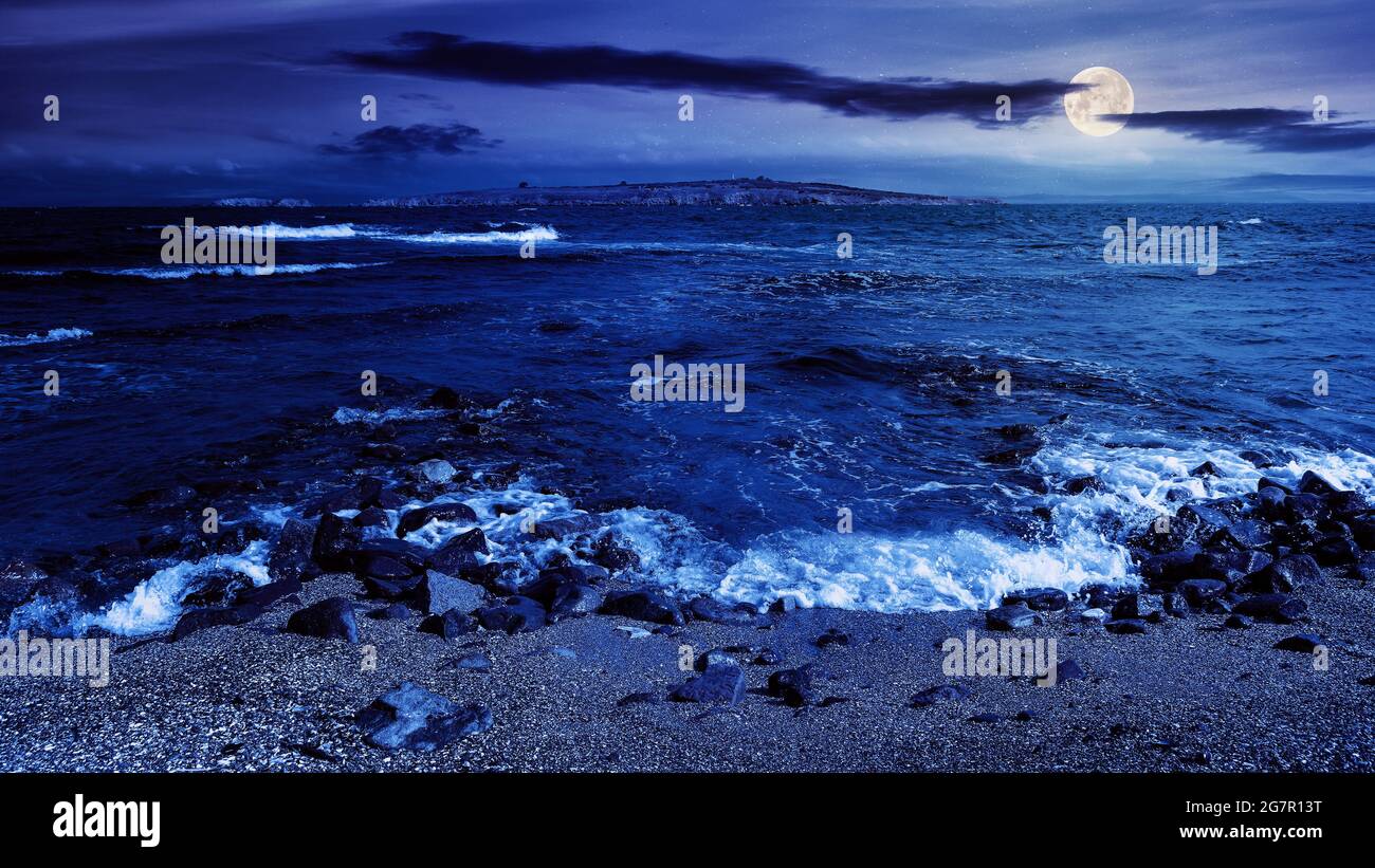 seascape at night. wonderful scenery with islands in full moon light ...