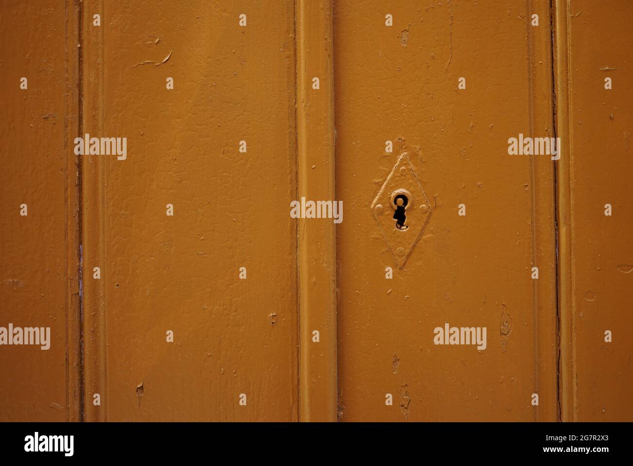 Selective focus shot of a painted door with a keyhole Stock Photo - Alamy