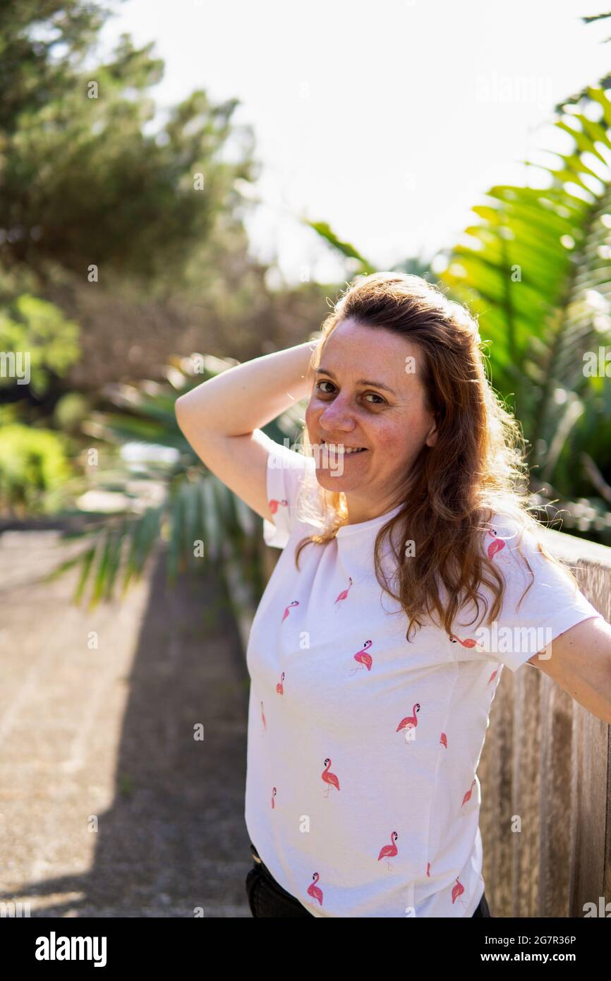 Middle-aged Spanish woman looking at the camera and smiling Stock Photo ...