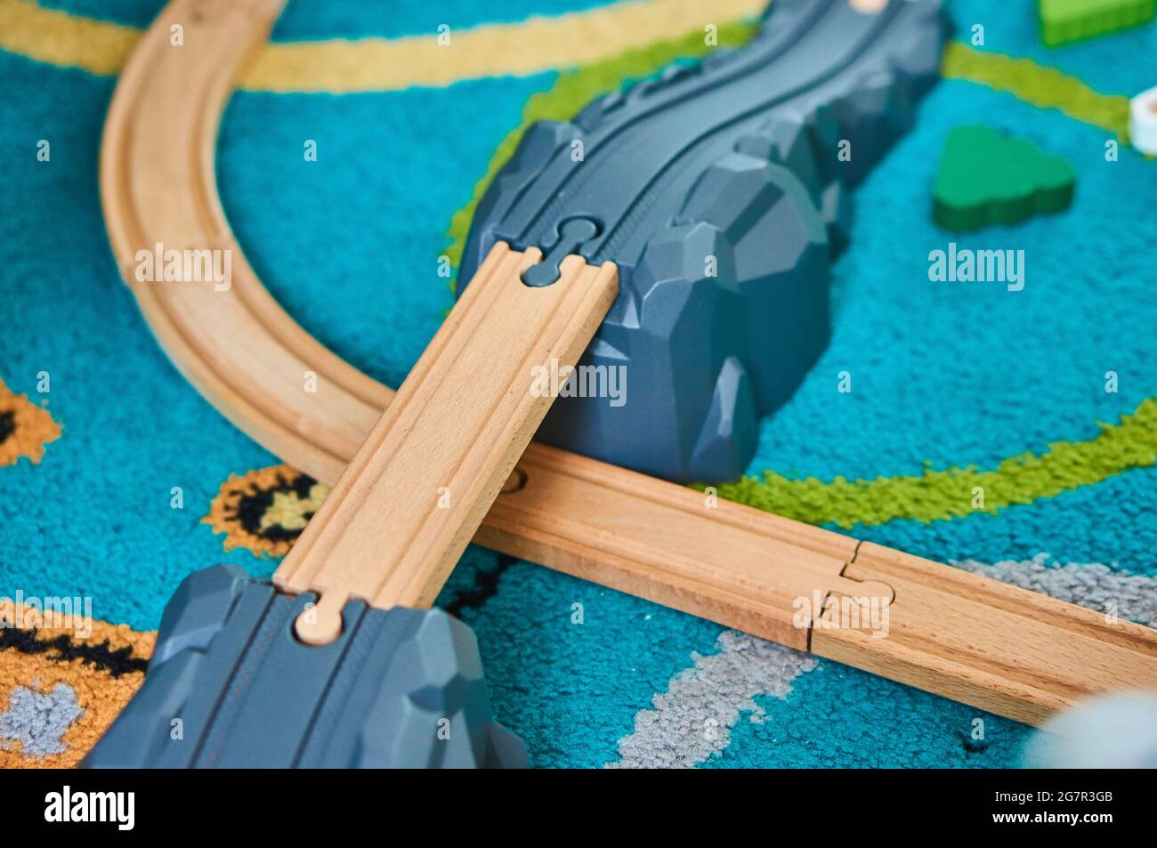 Closeup of a toy railroad crossing on colorful background Stock Photo ...