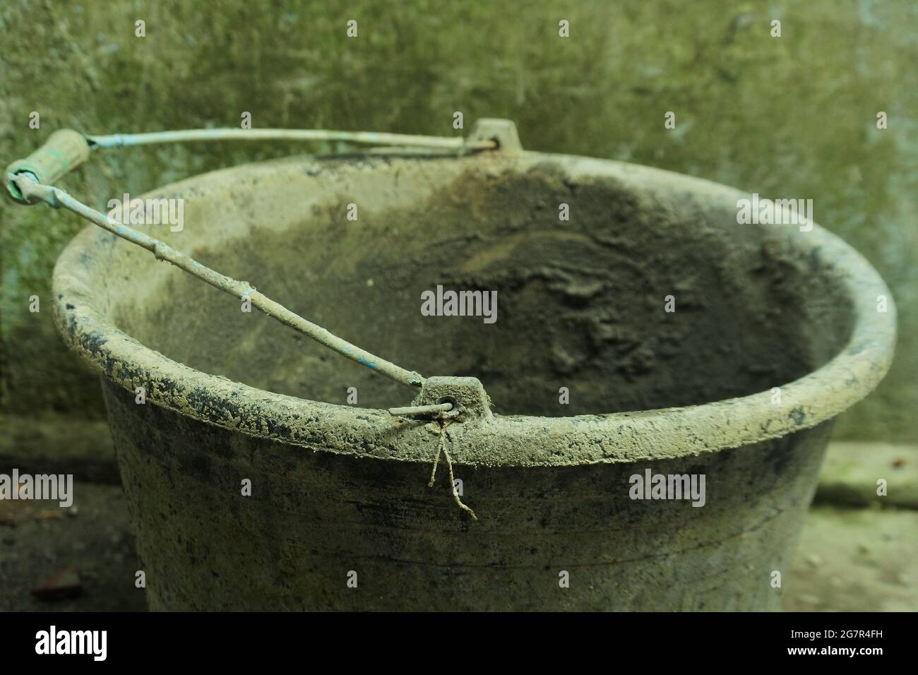 Old bucket with cement Stock Photo - Alamy