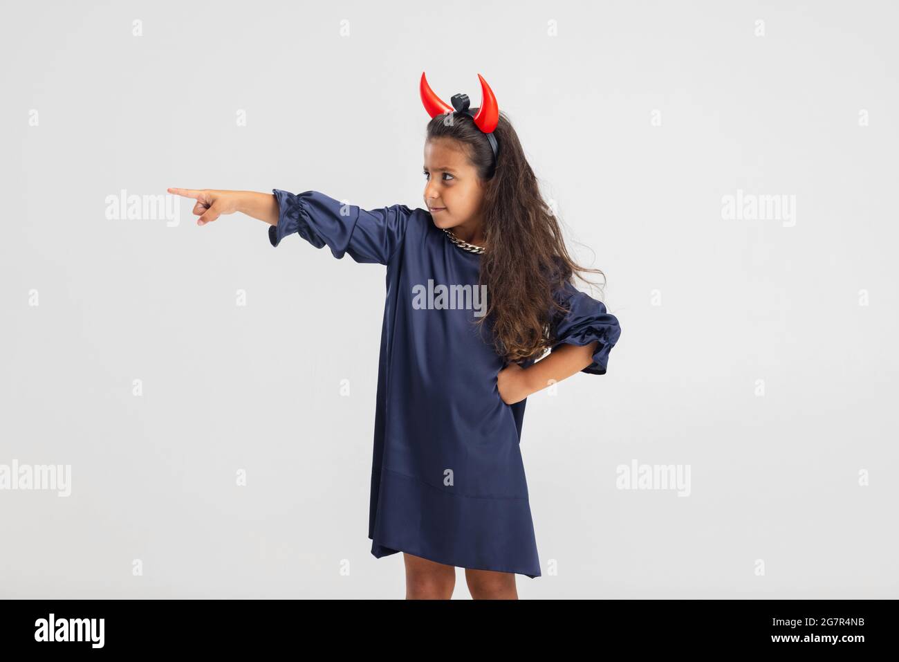 Half-length portrait of one cute Caucasian preschool girl with red toy ...