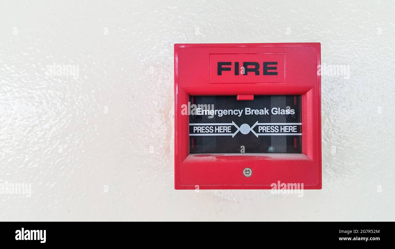 fire break glass on white wall background Stock Photo - Alamy