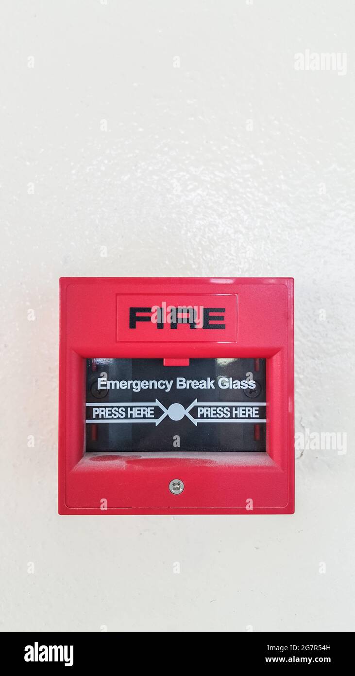 fire break glass on white wall background Stock Photo - Alamy