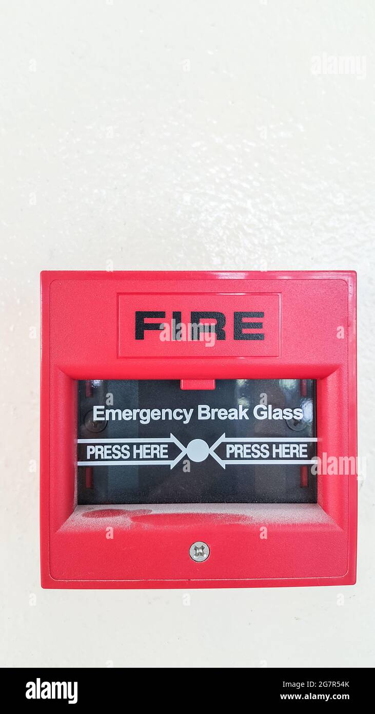 fire break glass on white wall background Stock Photo - Alamy