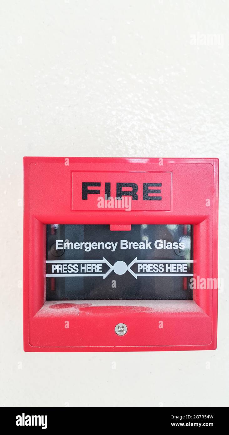 fire break glass on white wall background Stock Photo - Alamy