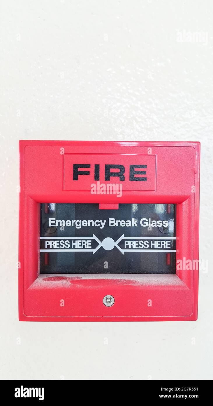fire break glass on white wall background Stock Photo - Alamy