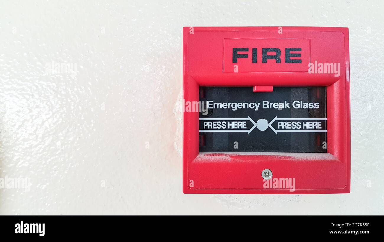 fire break glass on white wall background Stock Photo - Alamy