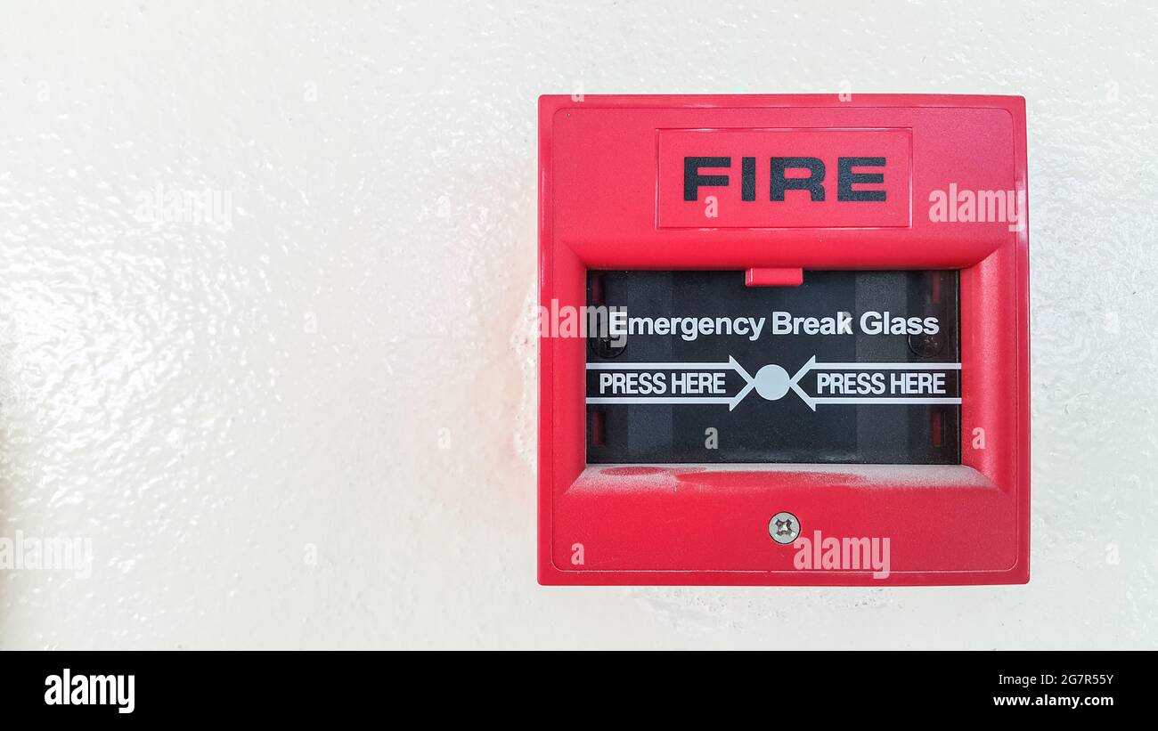 fire break glass on white wall background Stock Photo - Alamy