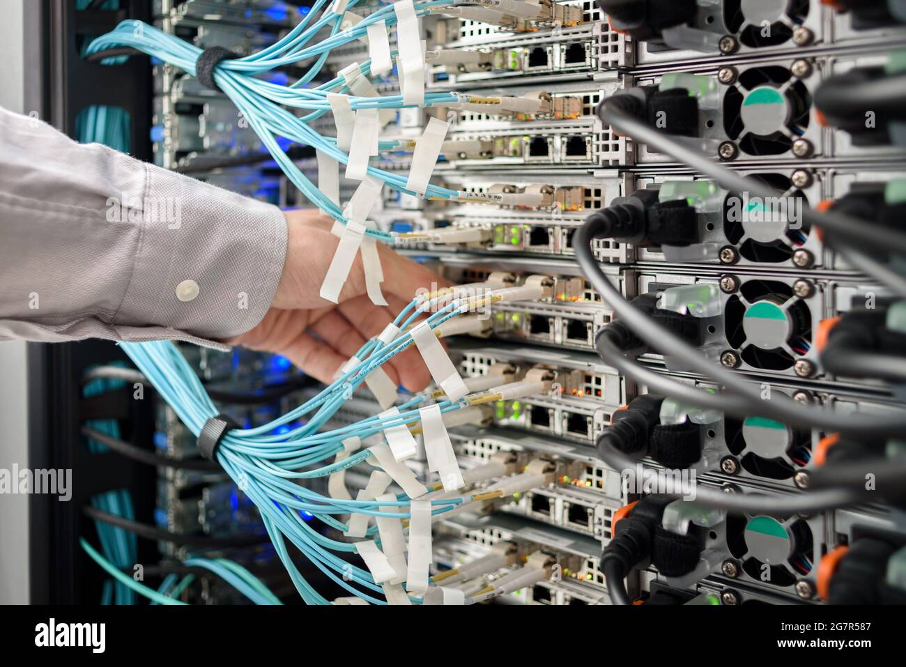 Hand of Man data center technician performing server maintenance ...