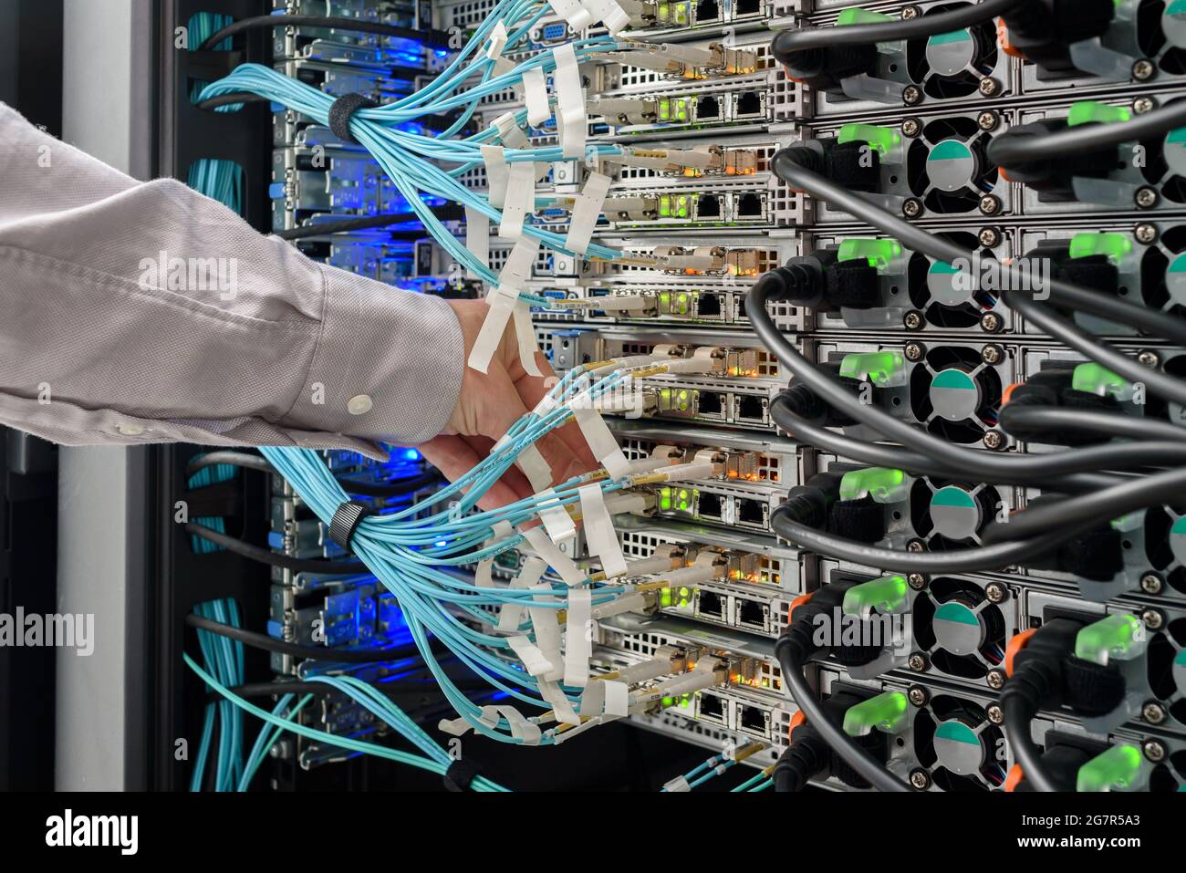 Hand of Man data center technician performing server maintenance ...