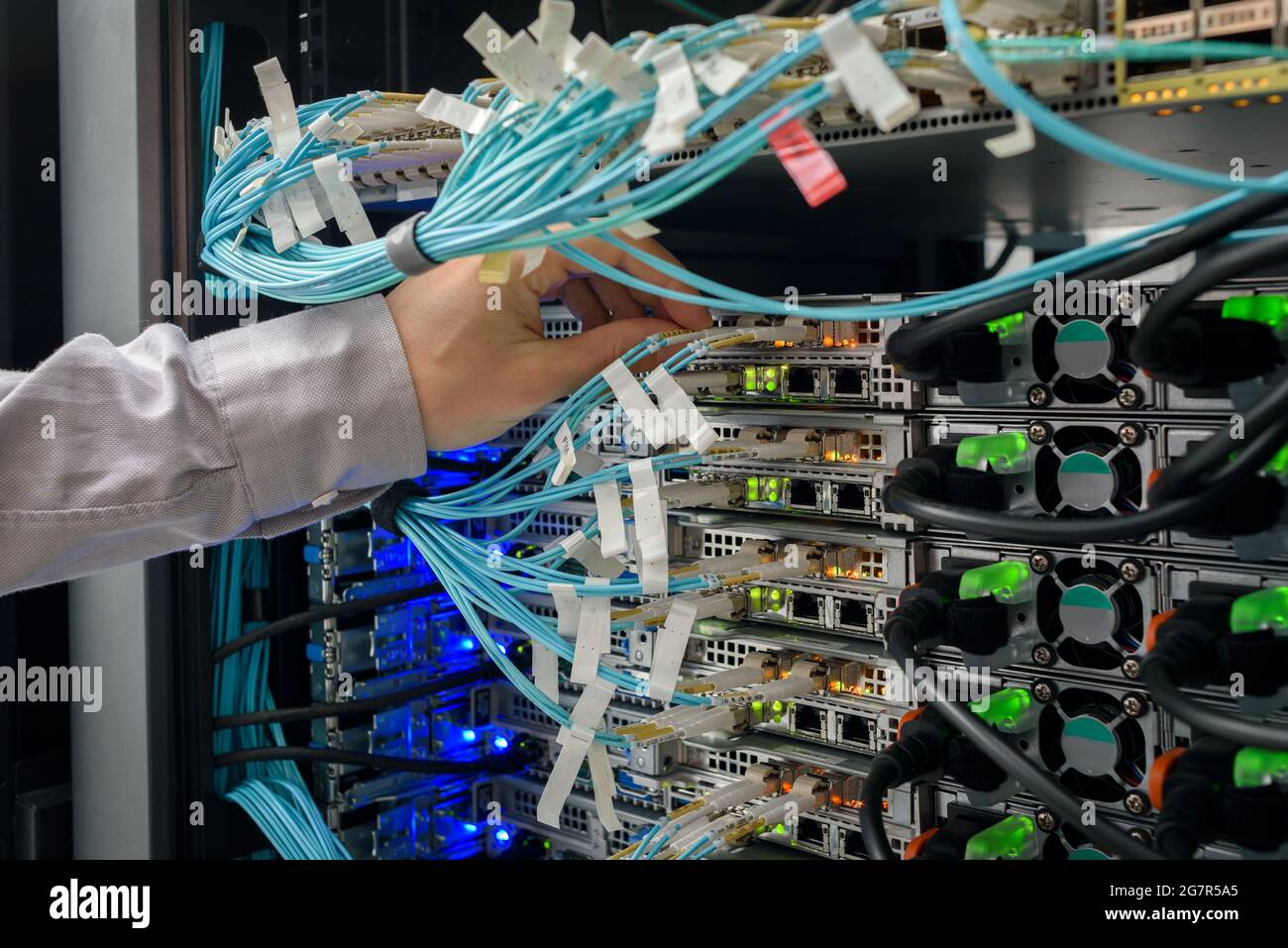 Hand of Man data center technician performing server maintenance ...