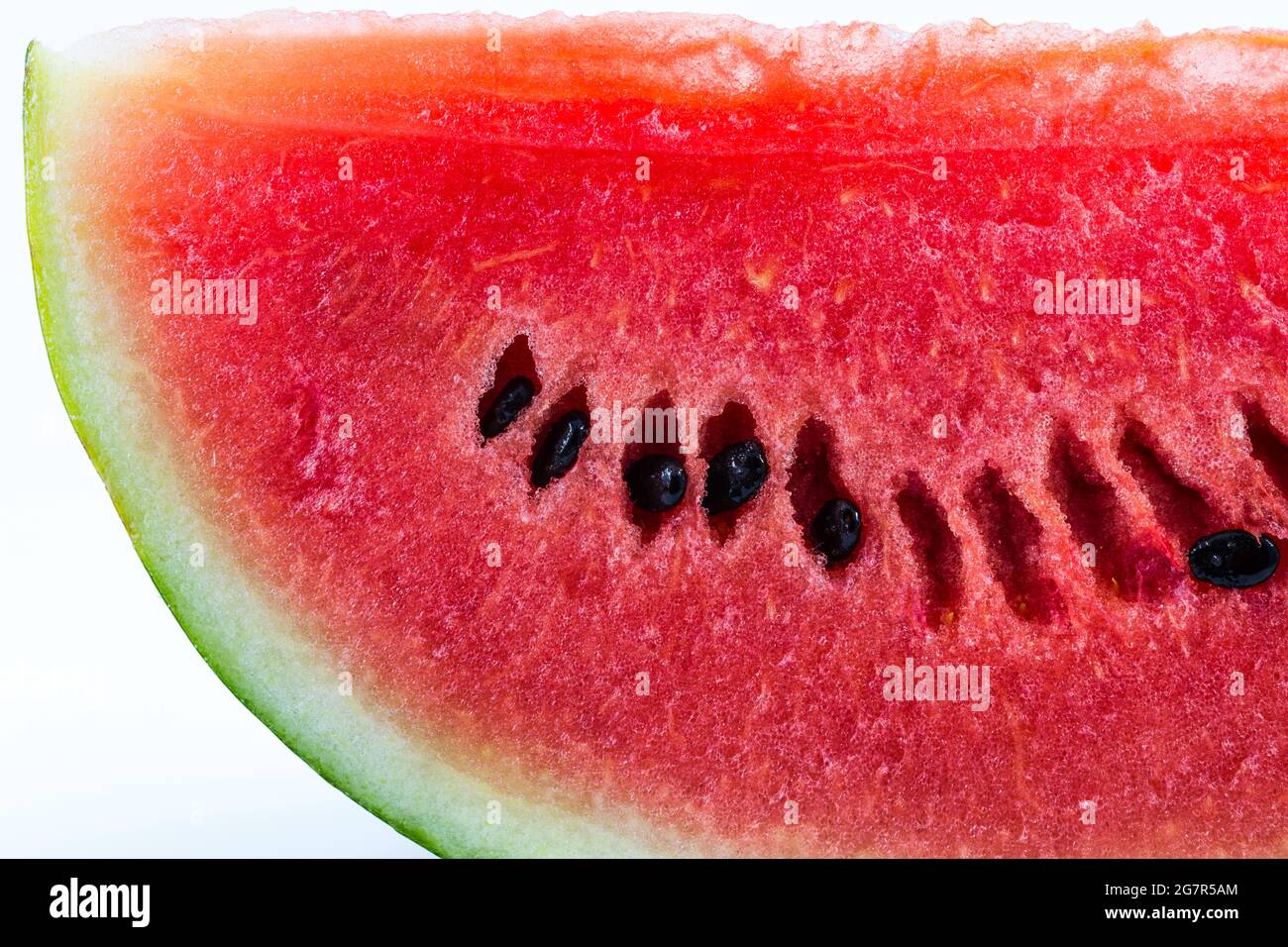 Red watermelon flesh and black seeds on white background Stock Photo ...