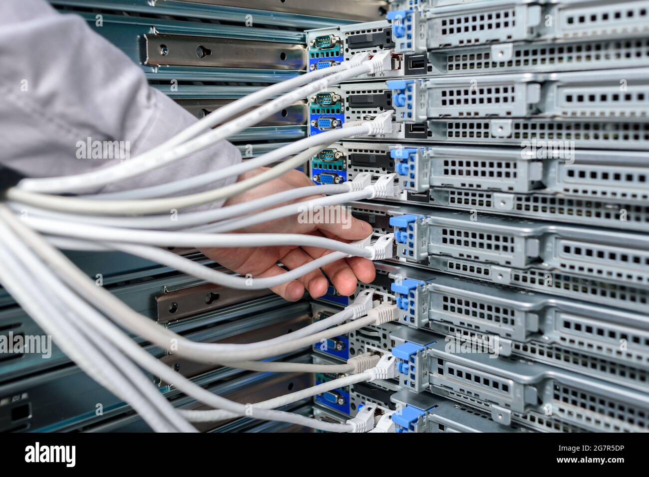 Hand of Man data center technician performing server maintenance ...