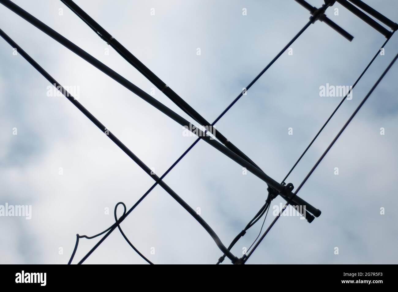 Double contact wire overhead along the street Stock Photo - Alamy